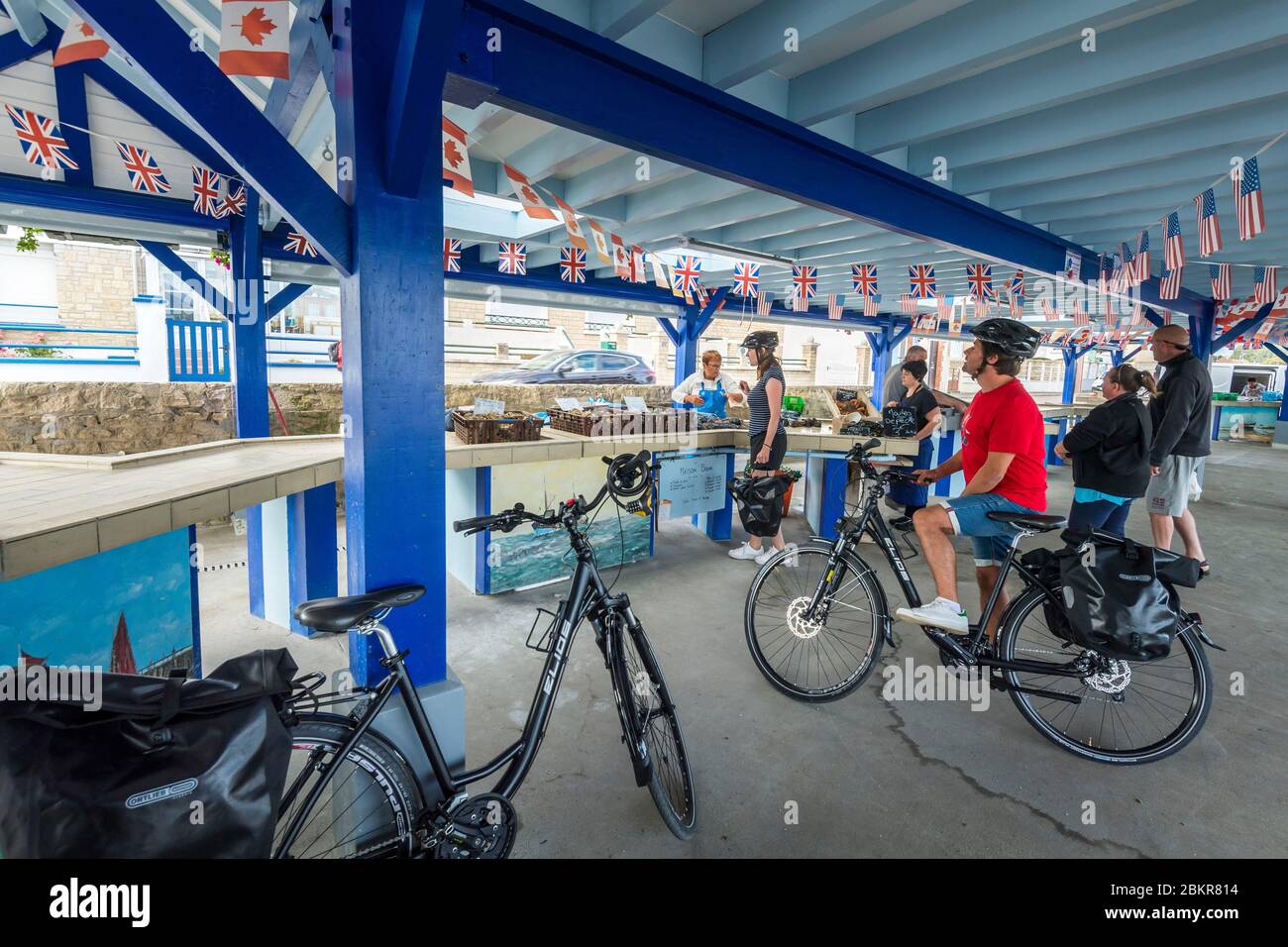 France, Calvados, Isigny-sur-Mer, cycle tourists at the market of the ...