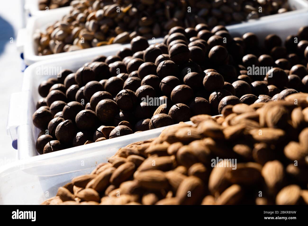 Various nuts in the store, juicy snacks sold in the market. Food for ...