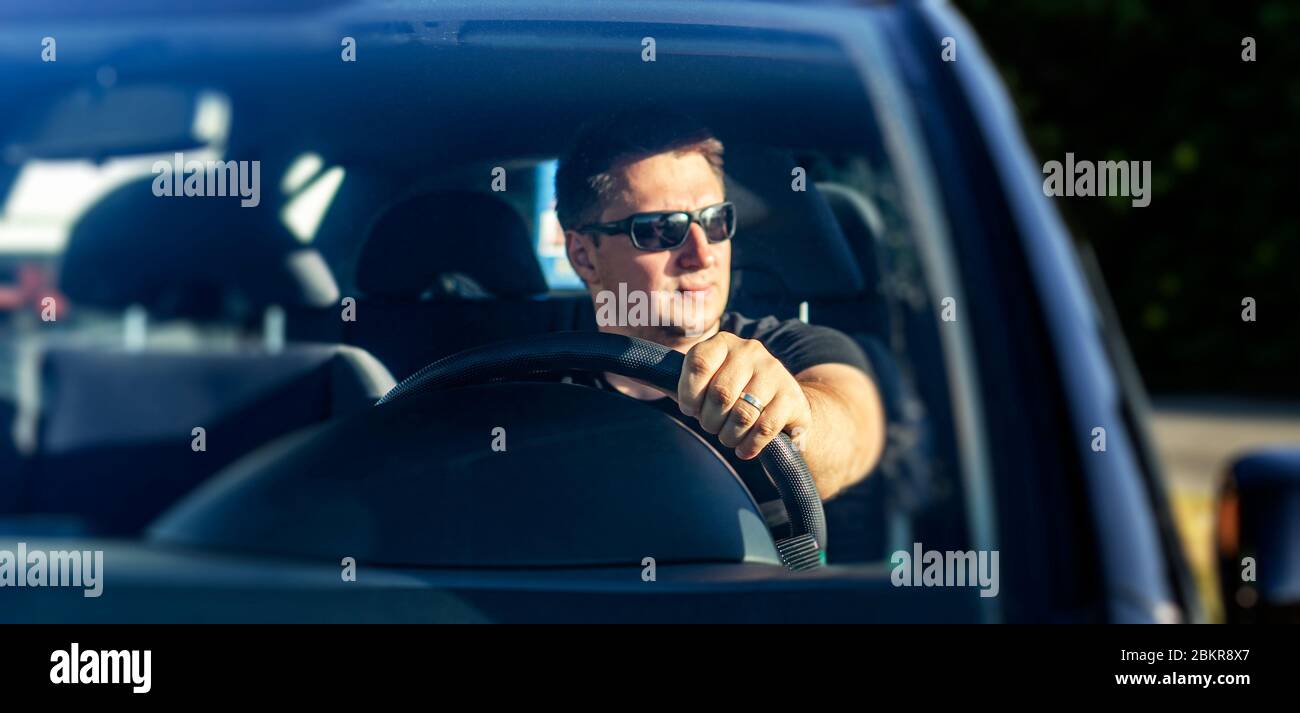 Happy handsome man driving car hi-res stock photography and images - Alamy
