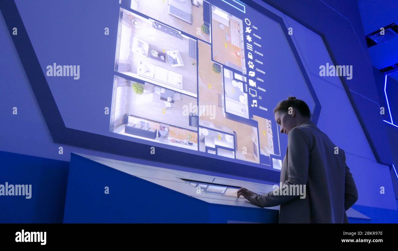 MOSCOW, RUSSIA - July 30, 2018: Smart City Exhibition. Woman using ...