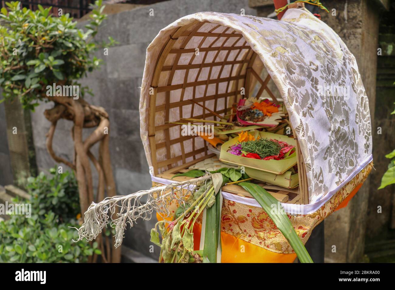 Altar woven from bamboo wicker, covered with white cloth with gold ...
