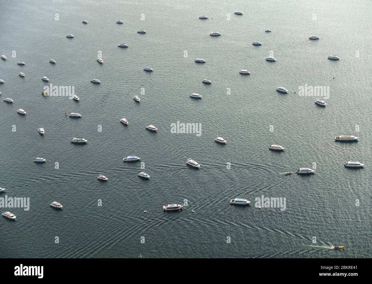 Overhead view of a lake with many small boats Stock Photo - Alamy