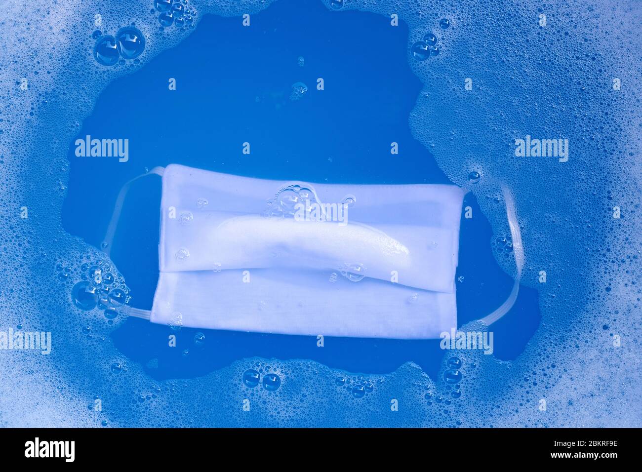 Cloth mask soak in powder detergent water dissolution before washing ...