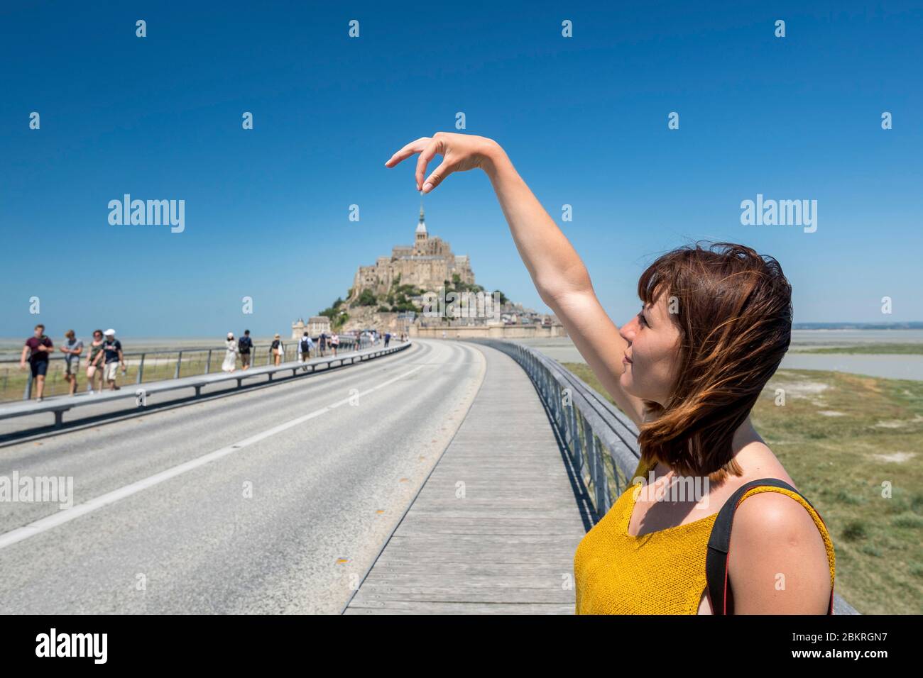 France, Manche, le Mont-Saint-Michel, young woman seizing the ...