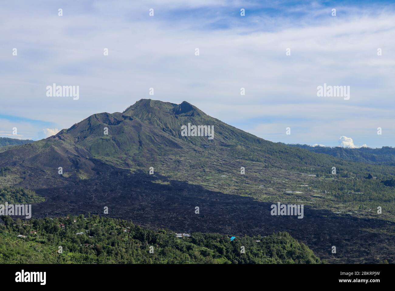 Volcano landscape with lava fields, pine tree forest and farms and ...