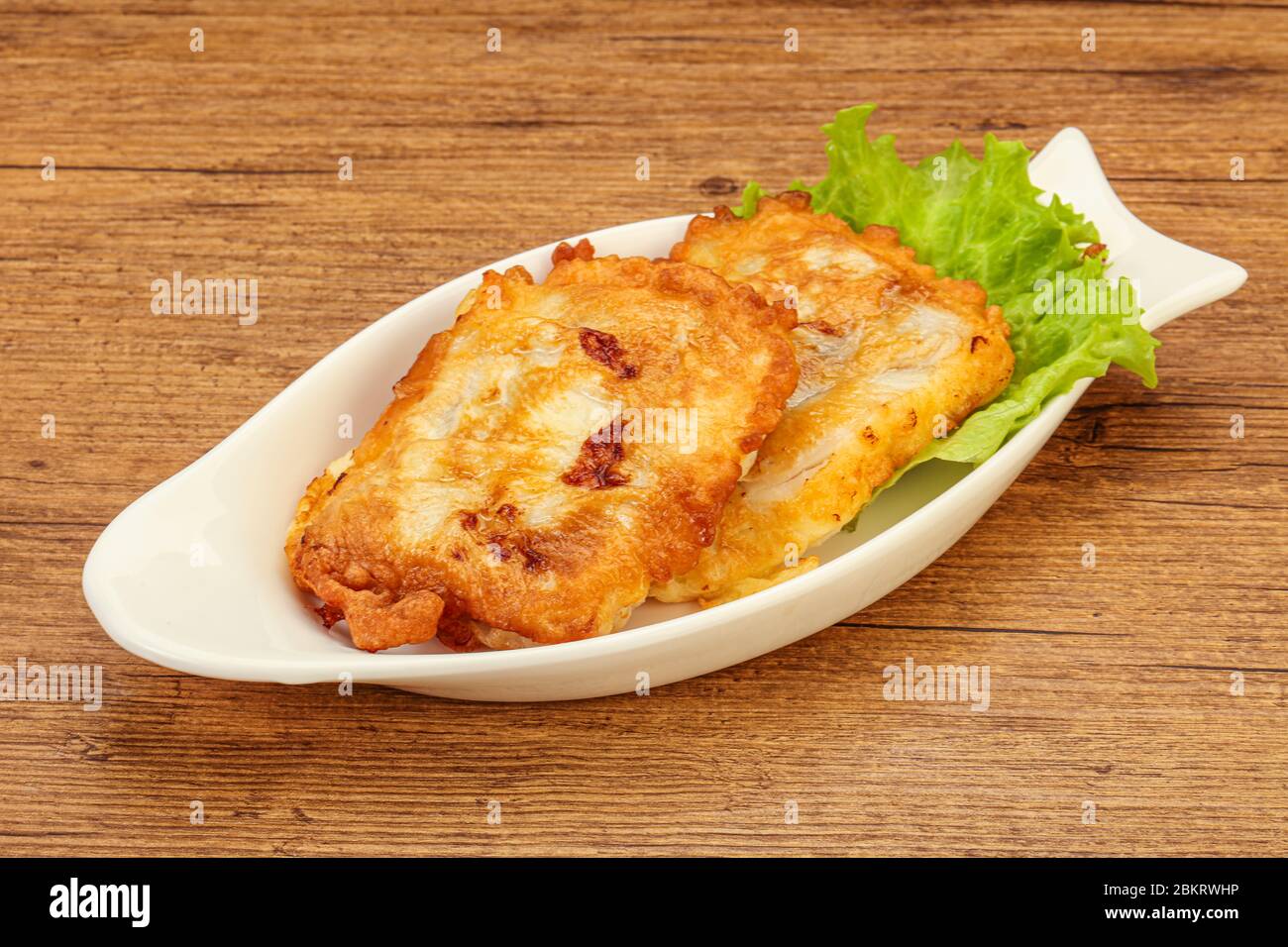 Roasted cod fish in the bread Stock Photo - Alamy