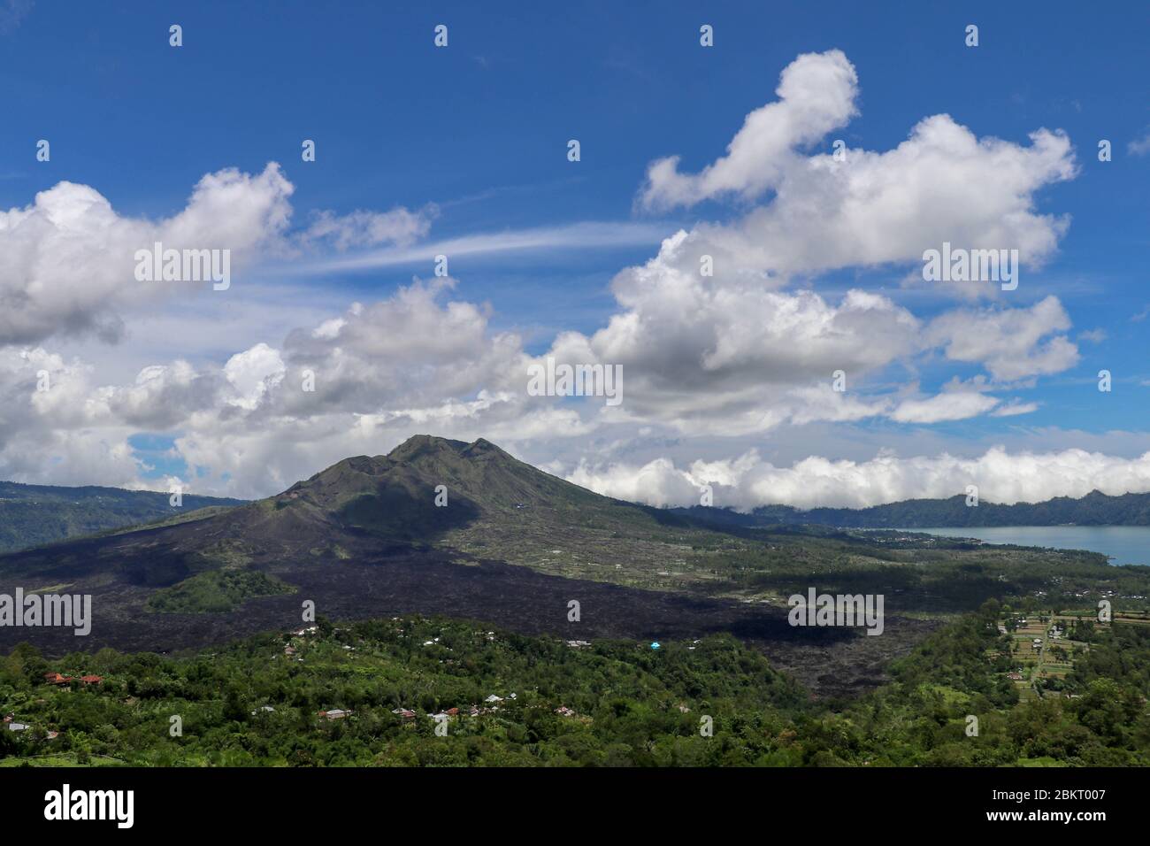 Volcano landscape with lava fields, pine tree forest and farms and ...