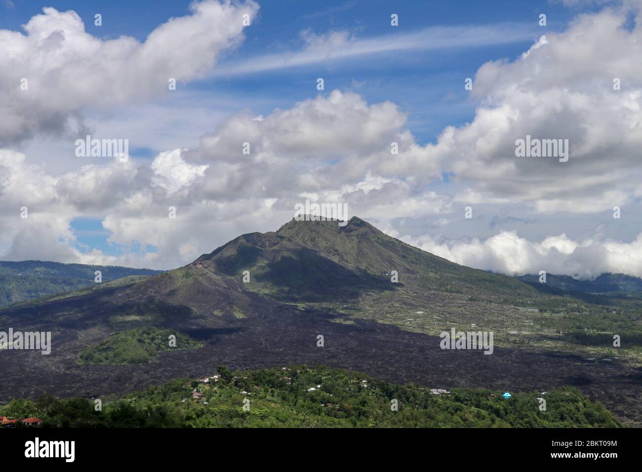 Volcano landscape with lava fields, pine tree forest and farms and ...