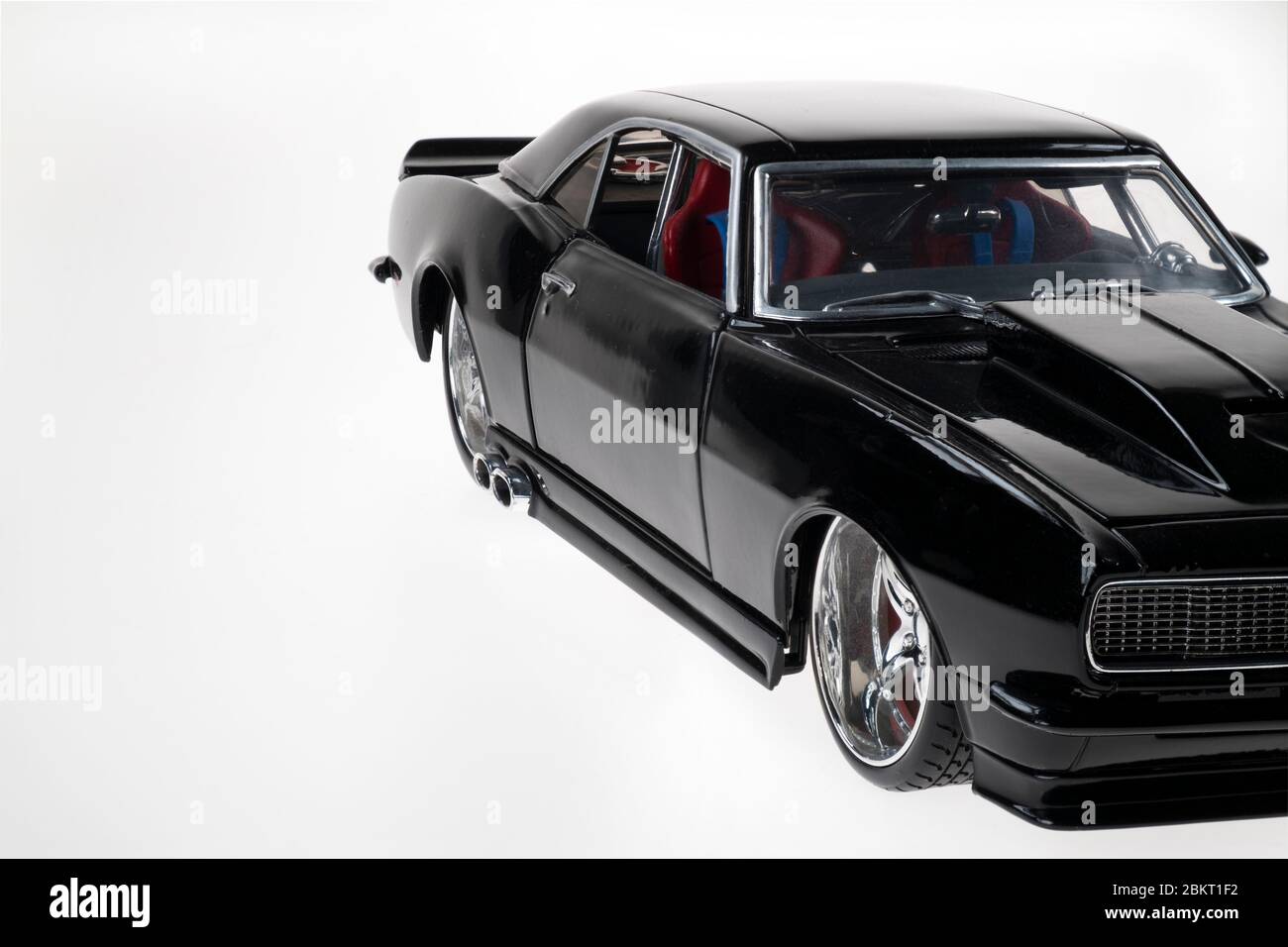 A modified black American Car isolated on white Stock Photo - Alamy