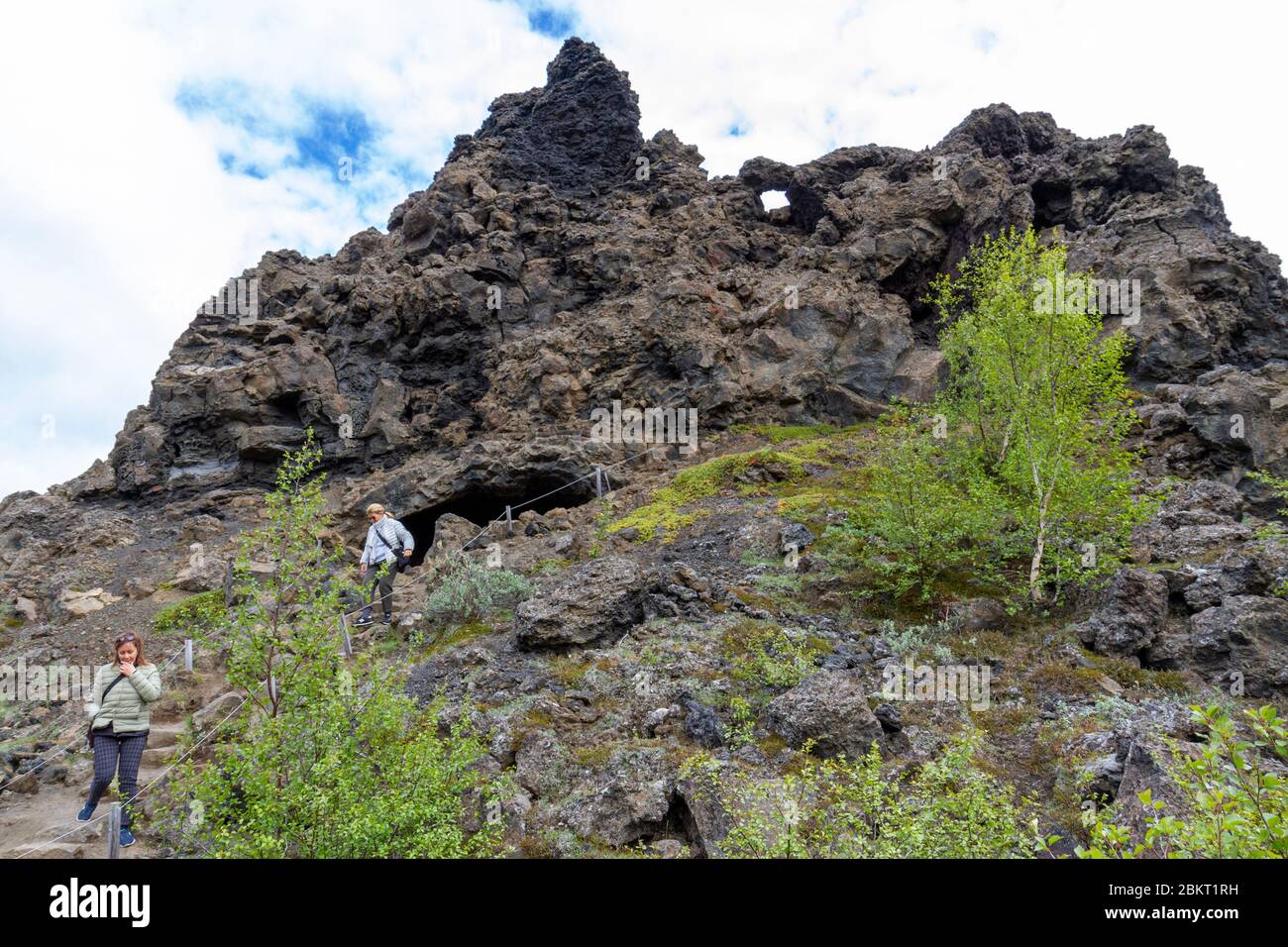 Visitors walking on one of the many massive rocky outcrops in the ...