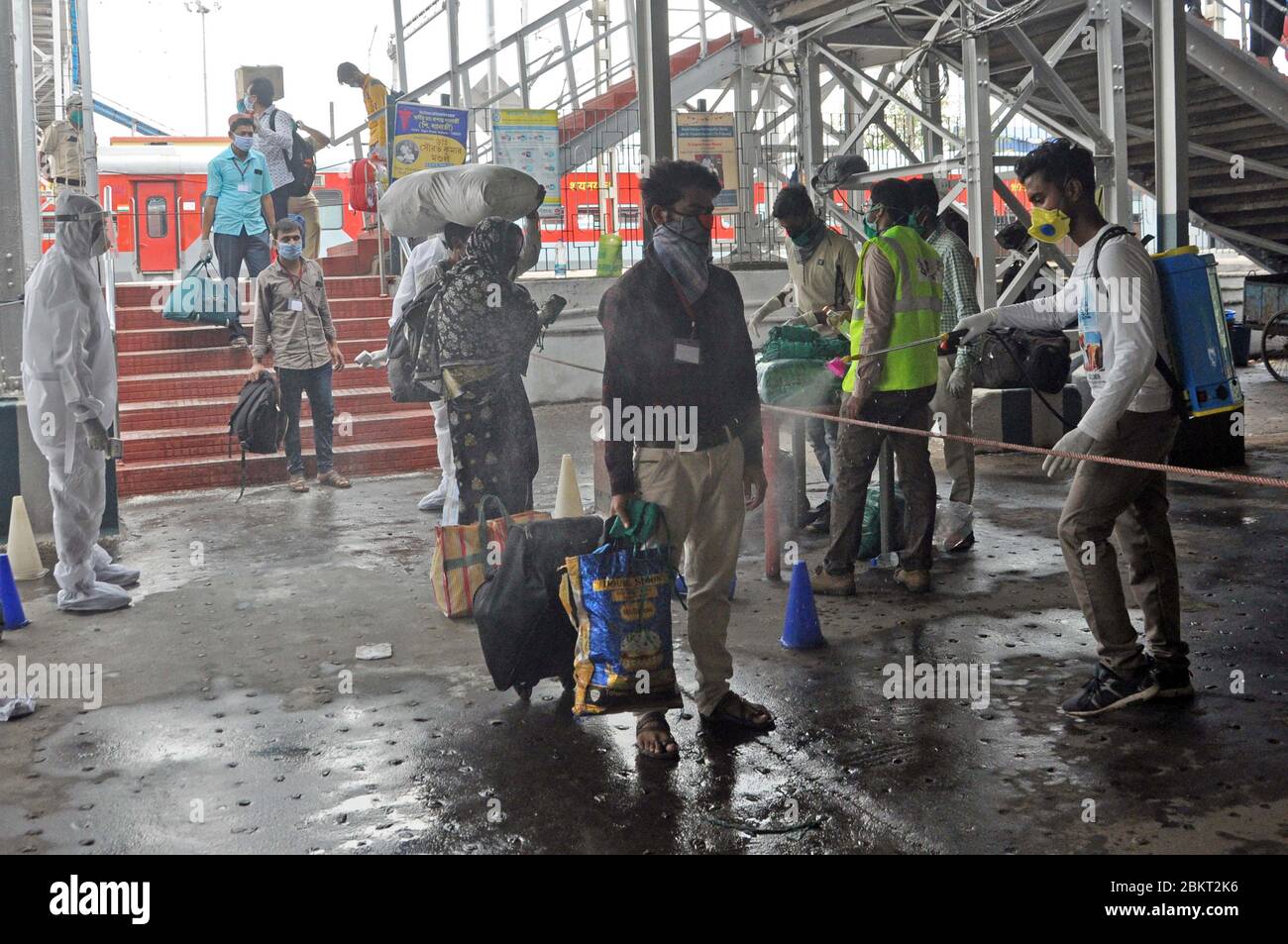 Dankuni, India. 05th May, 2020. (5/5/2020) Worker sprays disinfectant ...