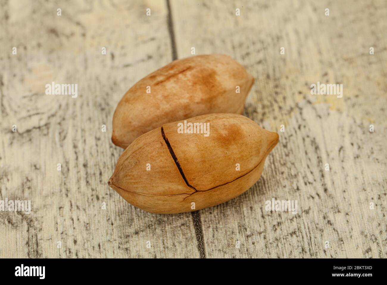 Ripe tasty Two whole pecan nuts Stock Photo - Alamy