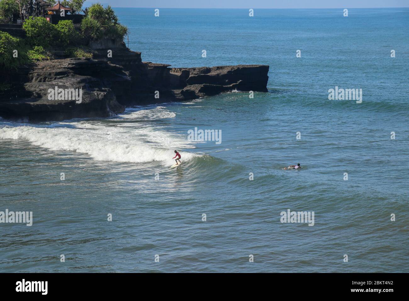 Surfer on the wave, catches a wave, surfing in the pipe. Surfing in the ...