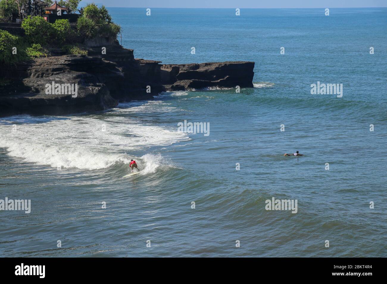 Surfer on the wave, catches a wave, surfing in the pipe. Surfing in the ...