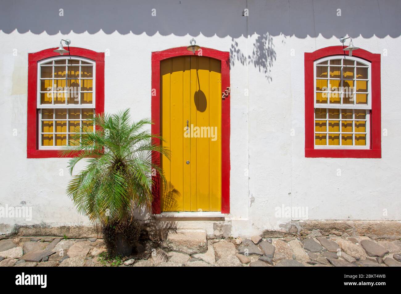 Street and old portuguese colonial houses in historic downtown in ...