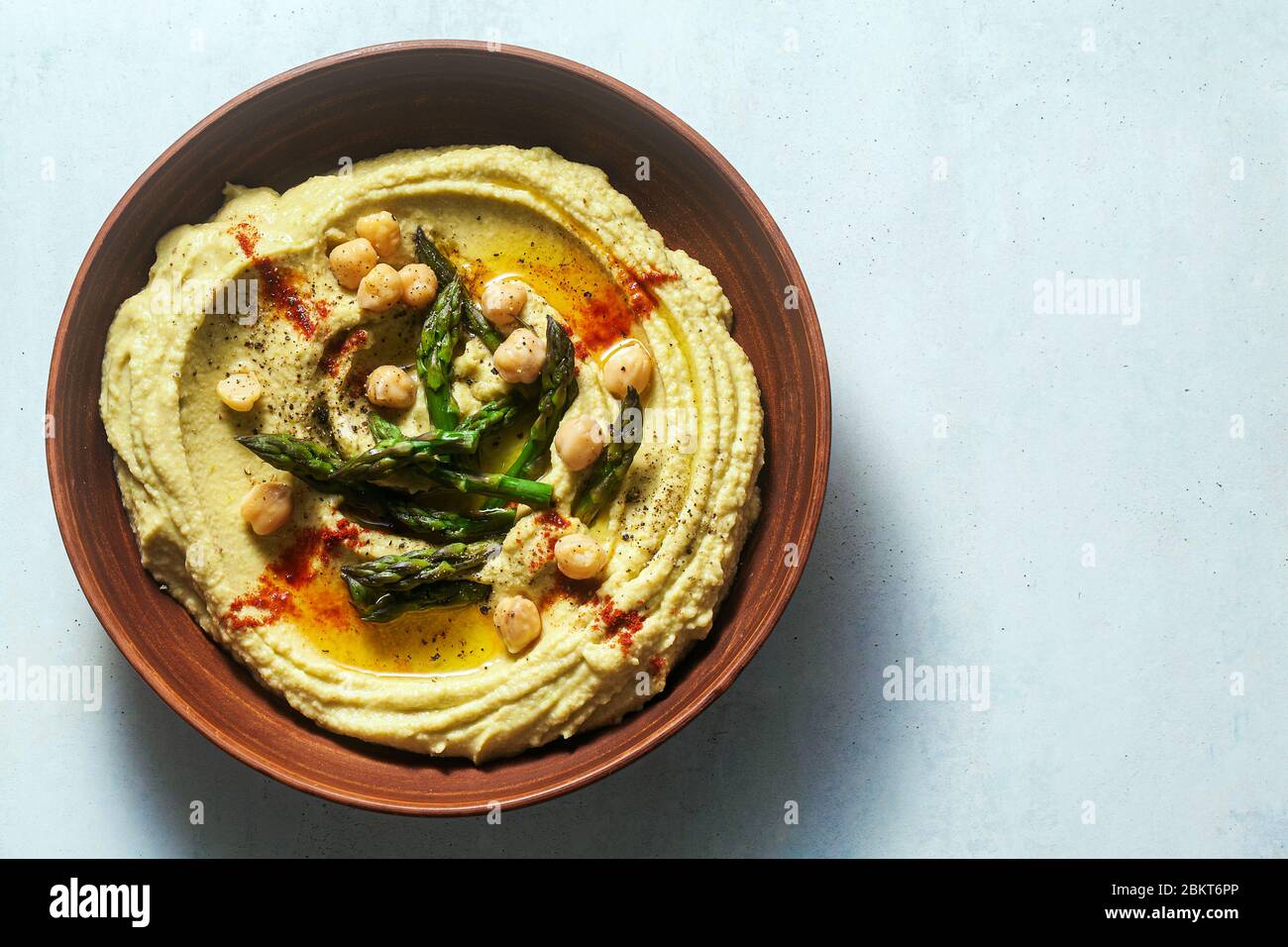 hummus with green asparagus. spring alternative recipe Stock Photo - Alamy