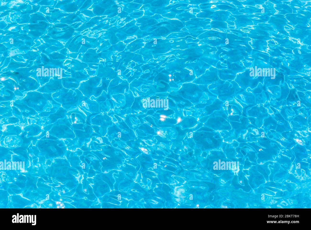 Swimming pool water surface in the sunlight texture background and ...