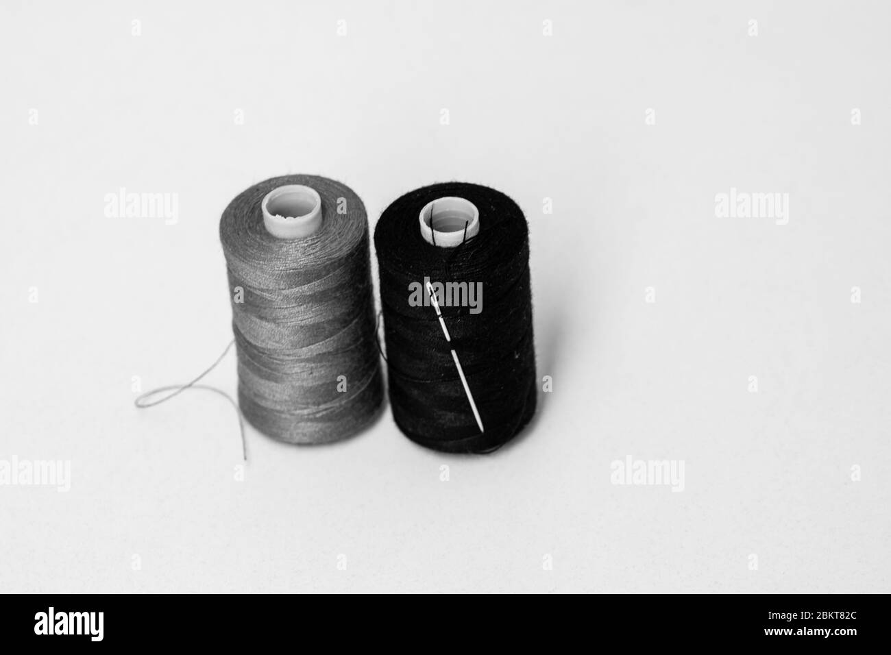 Black and white spools of sewing thread isolated, close up Stock Photo ...