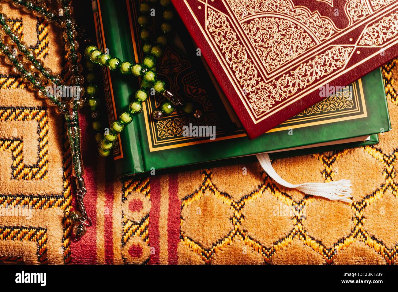 Islamic religious Holly books on prayer mat in oriental textures Stock ...