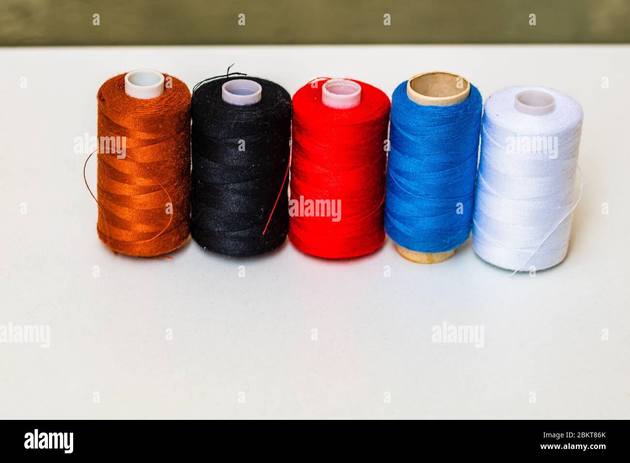 colorful spools of sewing thread isolated on white background Stock ...