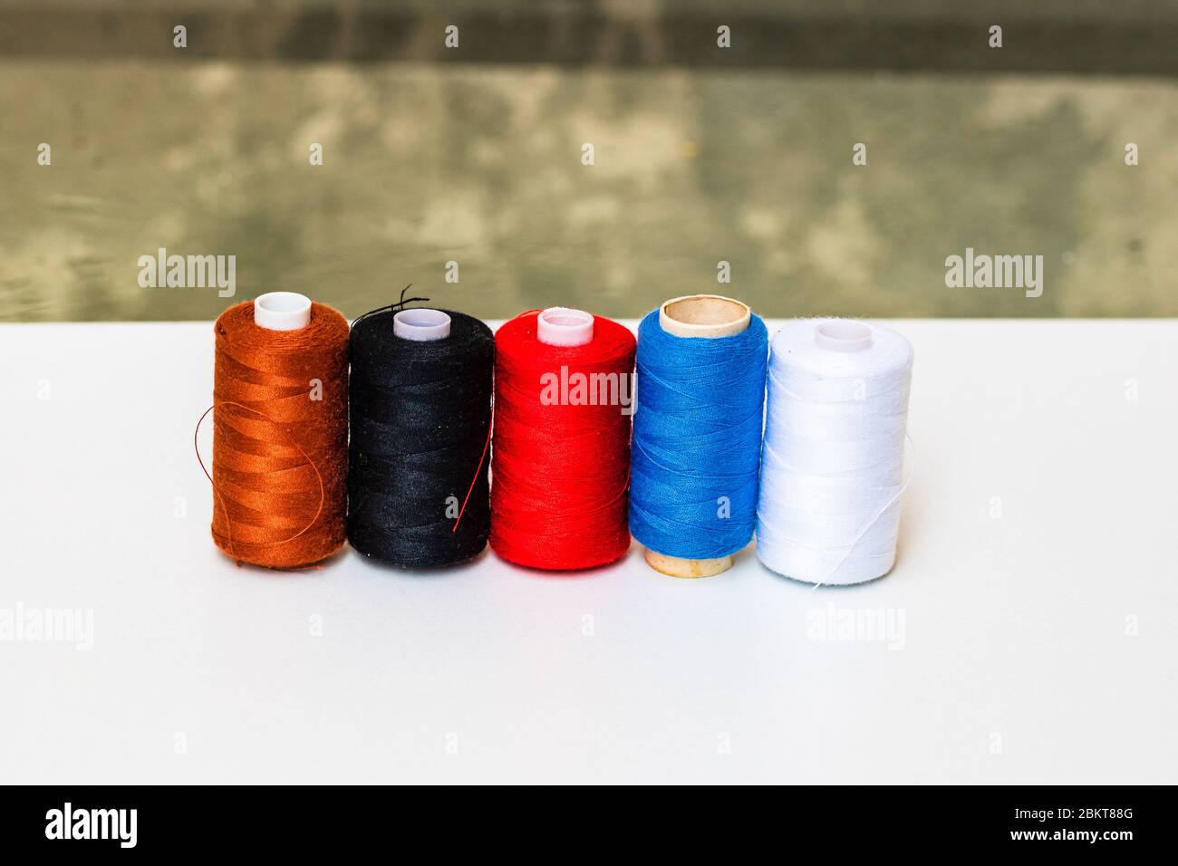 colorful spools of sewing thread isolated on white background Stock ...