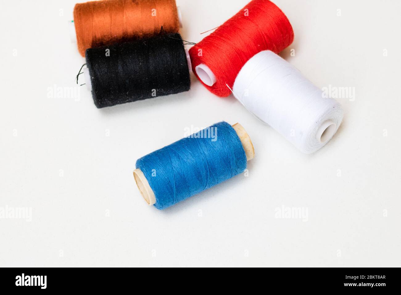 colorful spools of sewing thread isolated on white background Stock ...