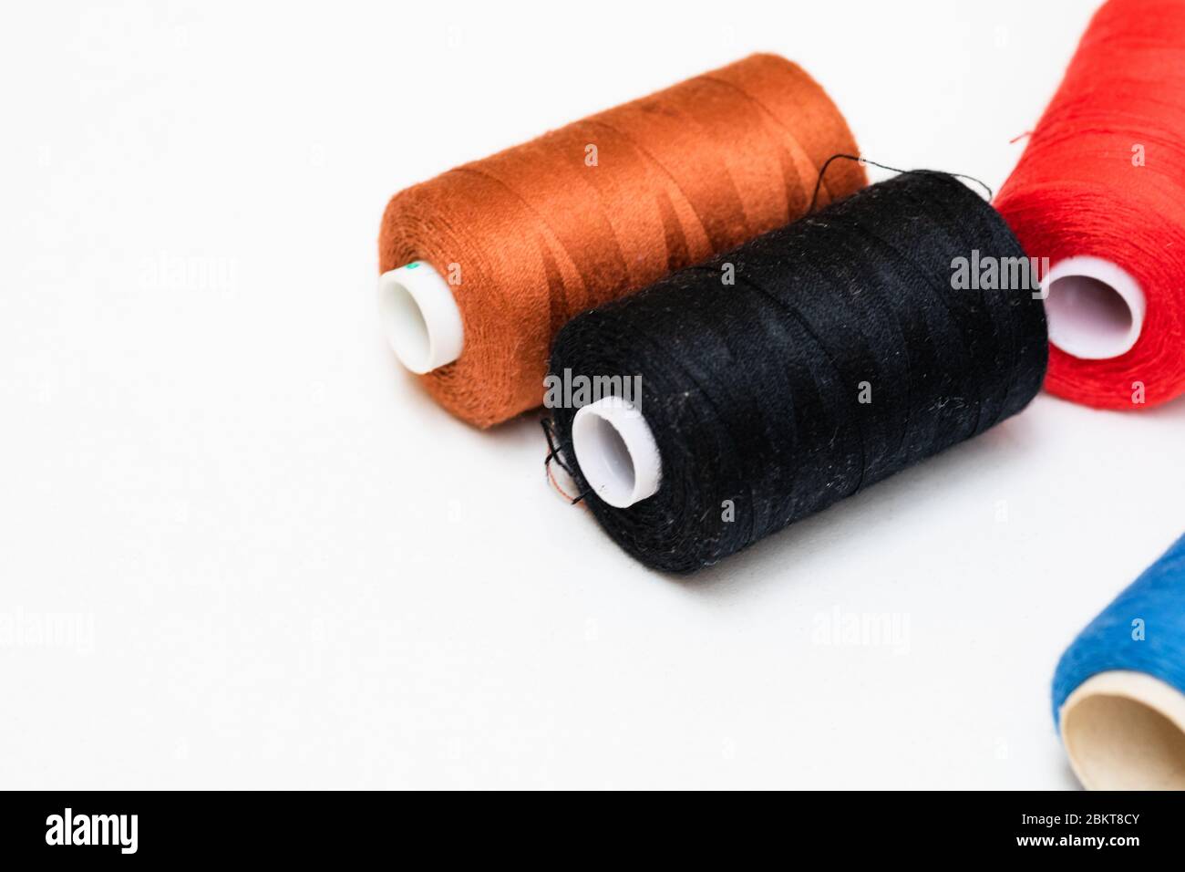 colorful spools of sewing thread isolated on white background Stock ...