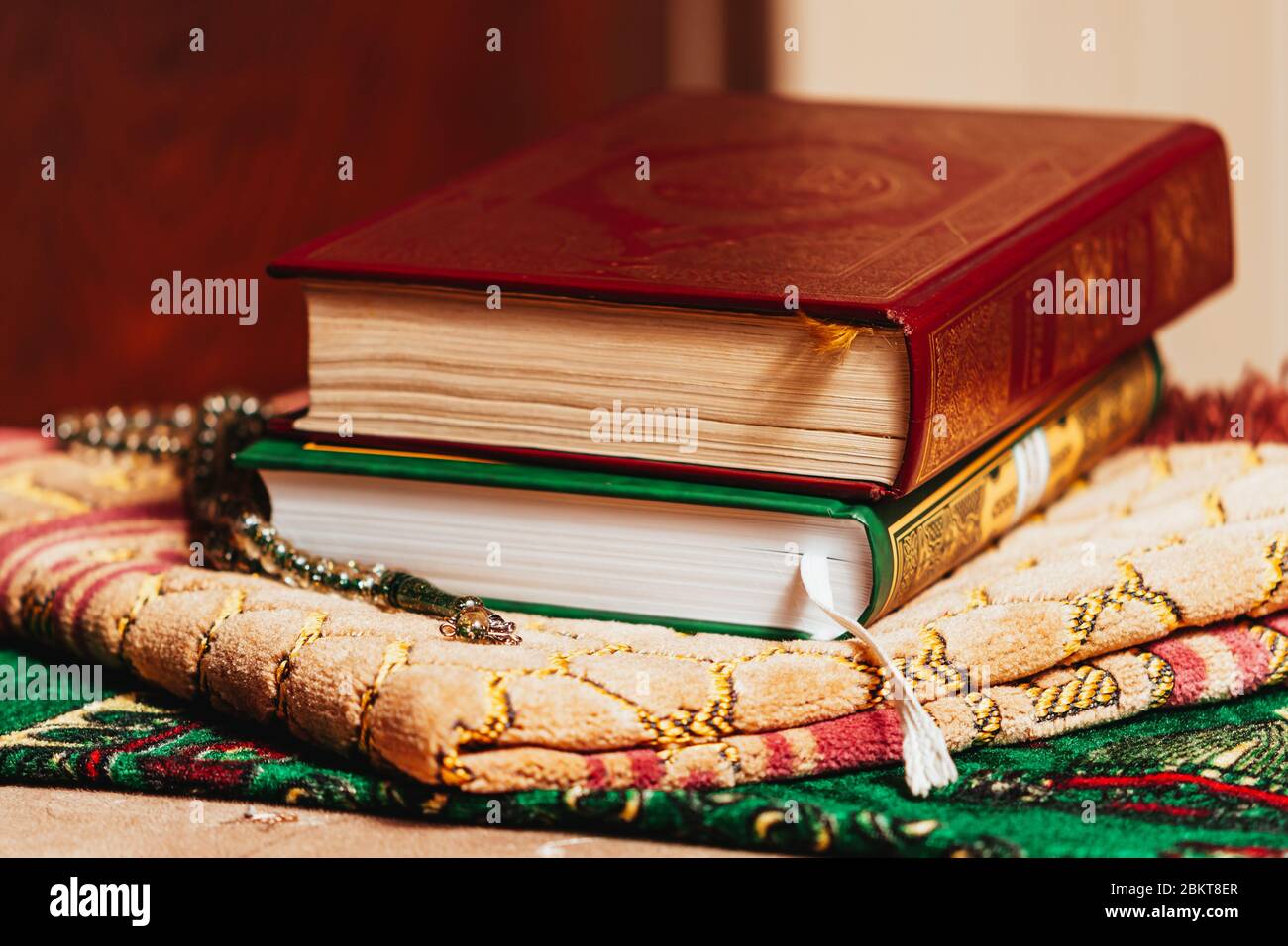 Islamic religious Holly books on prayer mat in oriental textures Stock ...