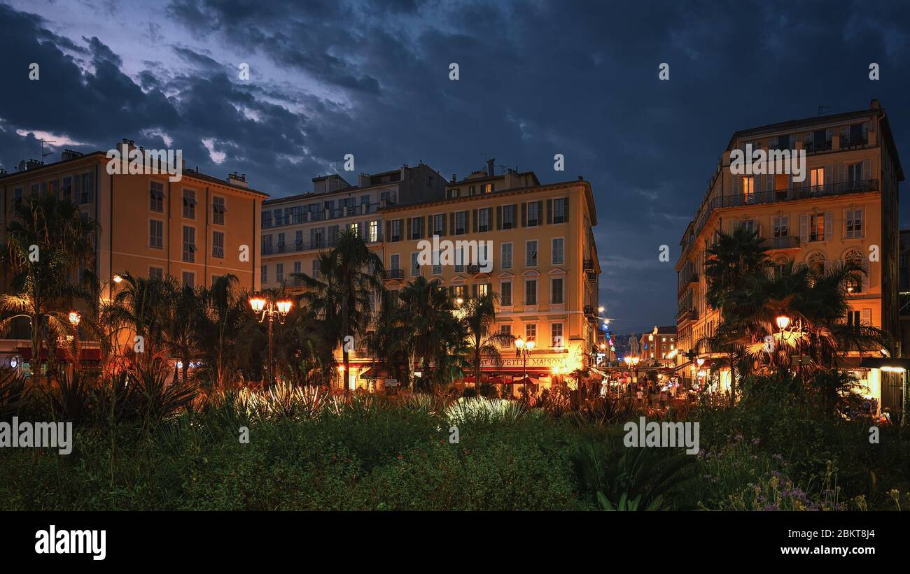 Nice, France, September 20, 2018: Nicely lit facades of old buildings ...