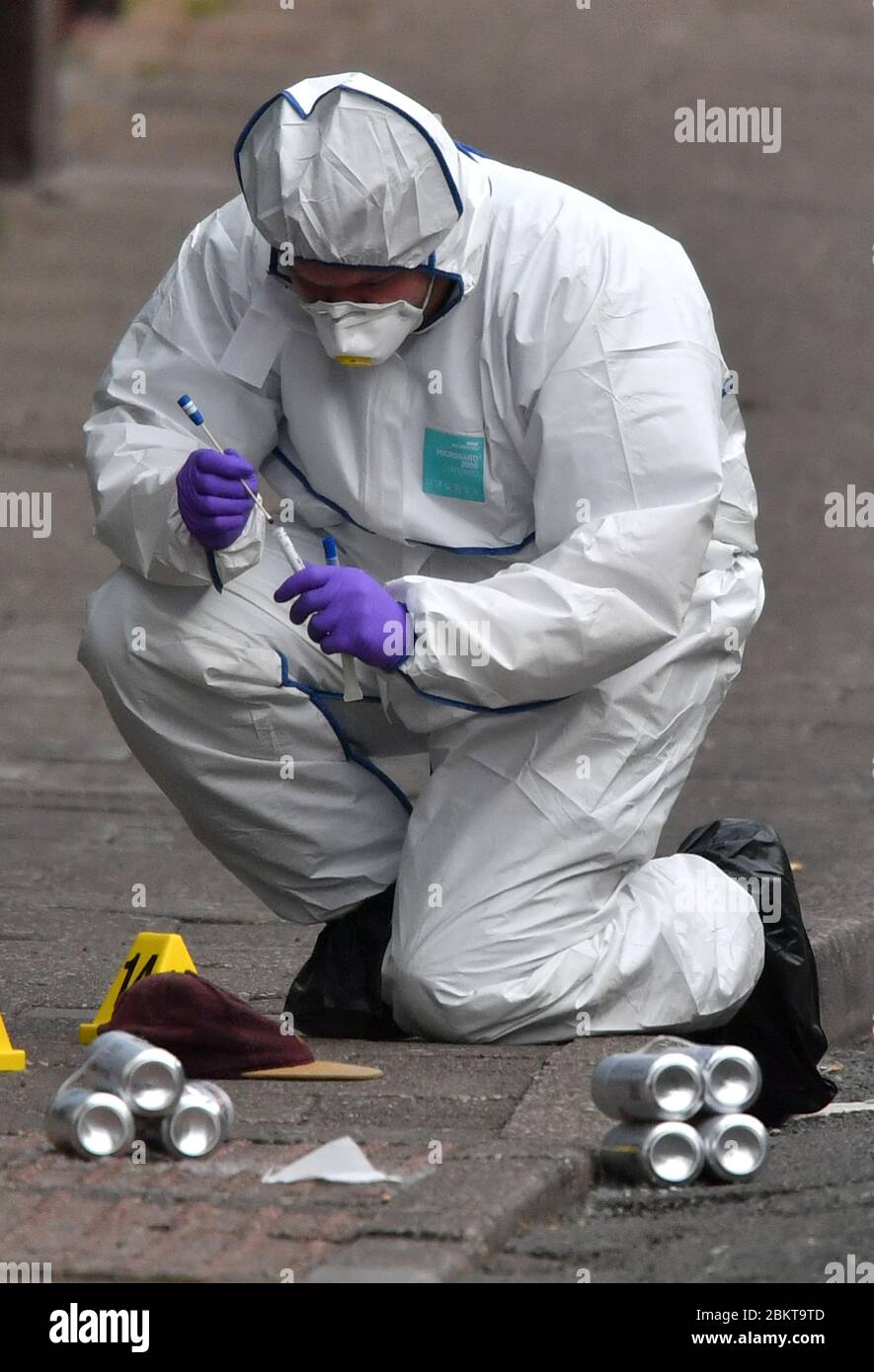 Forensic officers at the scene of a reported stabbing in the village of ...
