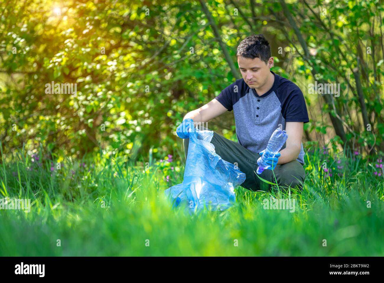 cleaning nature by collecting plastic waste, plastic bottles from the ...