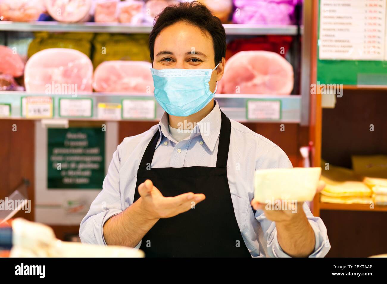 Shopkeeper working in his grocery store Stock Photo - Alamy