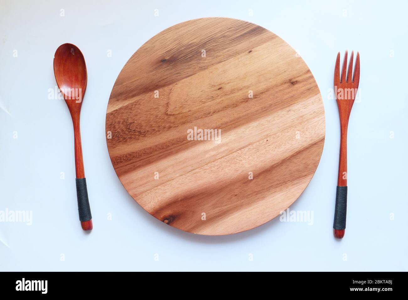 chopping board and fork on white background Stock Photo - Alamy