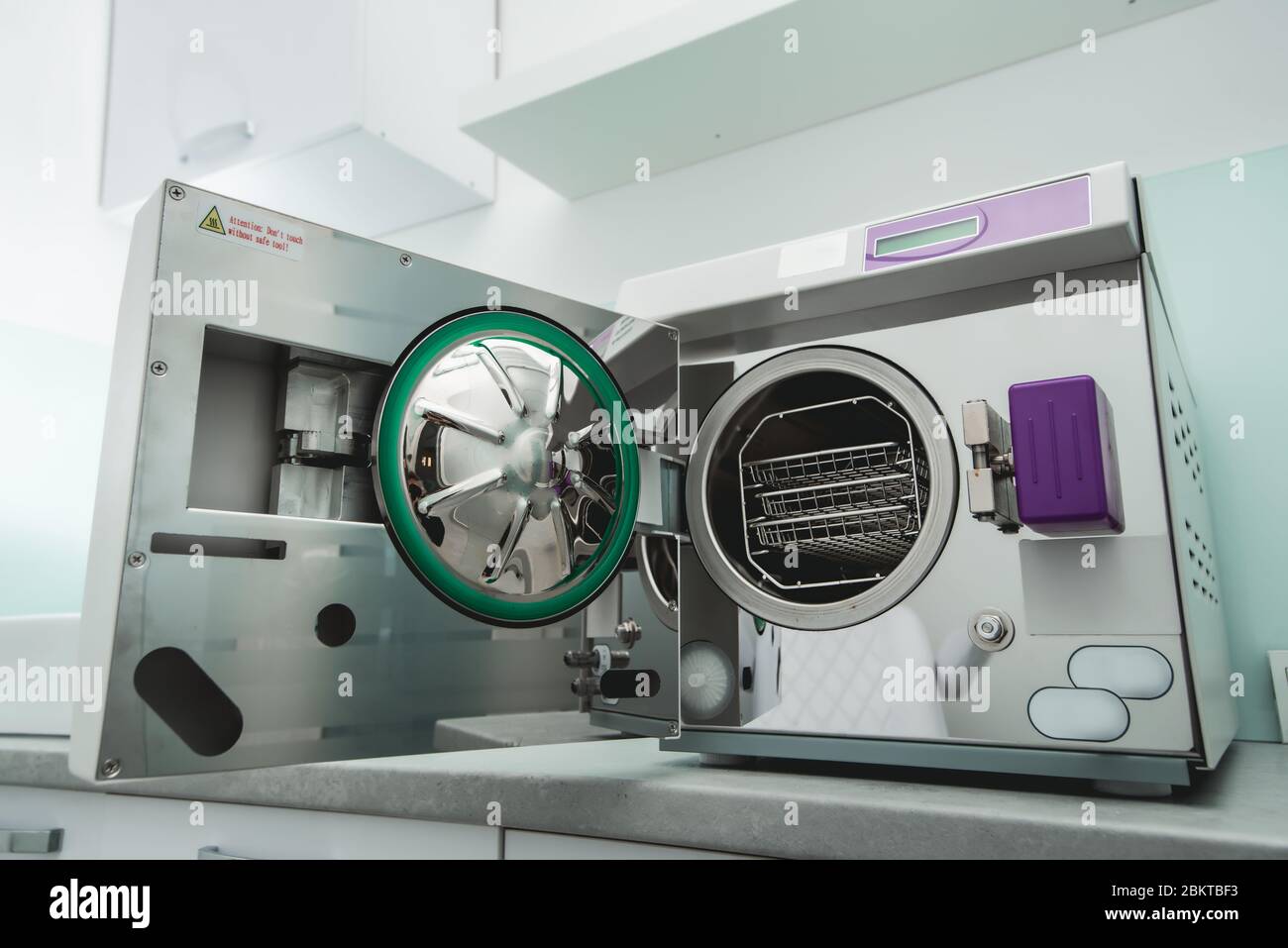 Steam sterilizer autoclave with the door open in a medical laboratory ...