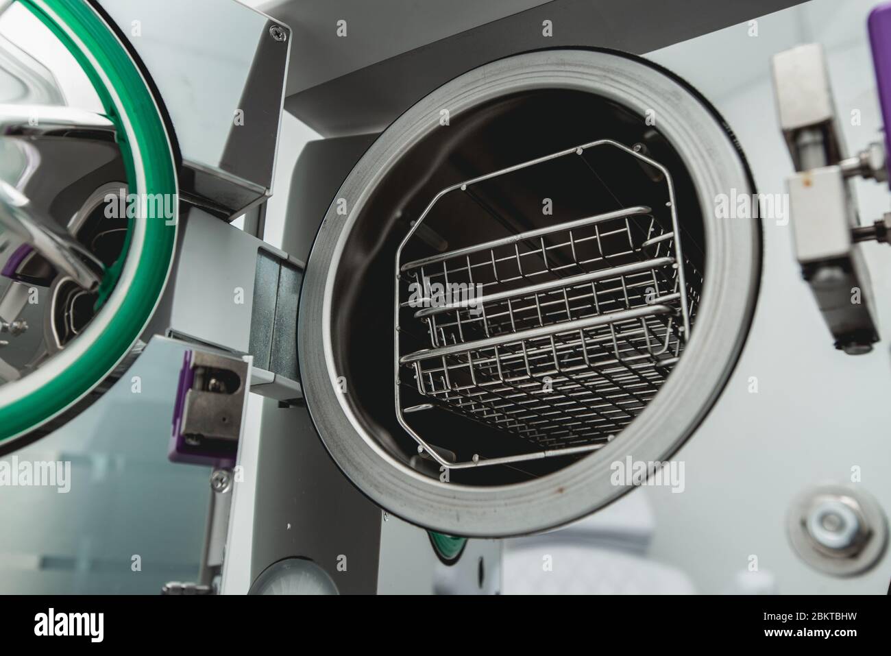 Steam sterilizer autoclave with the door open in a medical laboratory ...