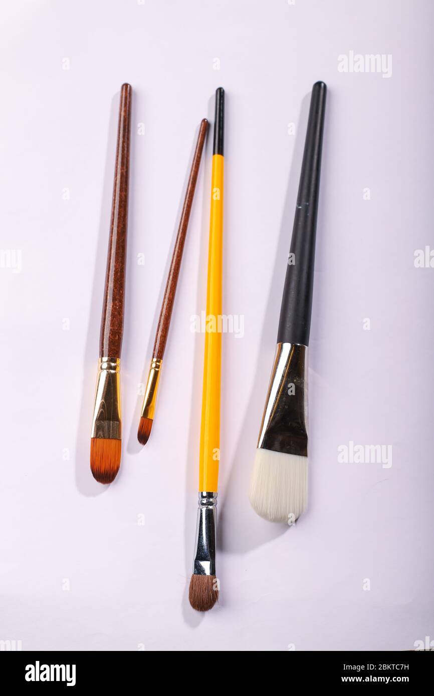 Art brushes of different sizes on a white background. Four brushes for ...