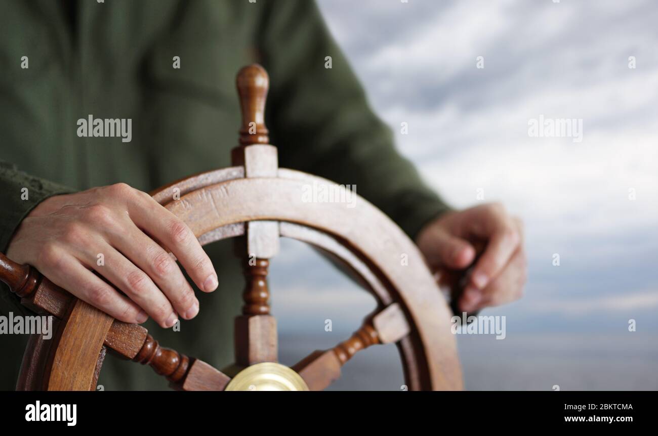 Hand on ship rudder Stock Photo - Alamy