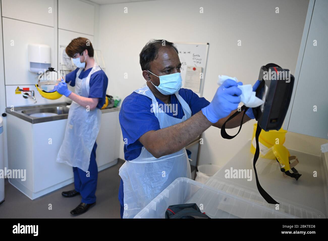 Clinical staff clean Personal Protective Equipment (PPE) at the Royal ...