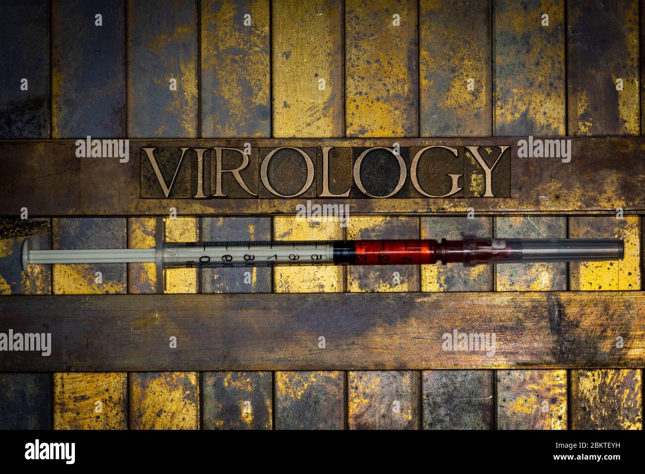 Photo of real authentic typeset letters forming Virology text with red ...