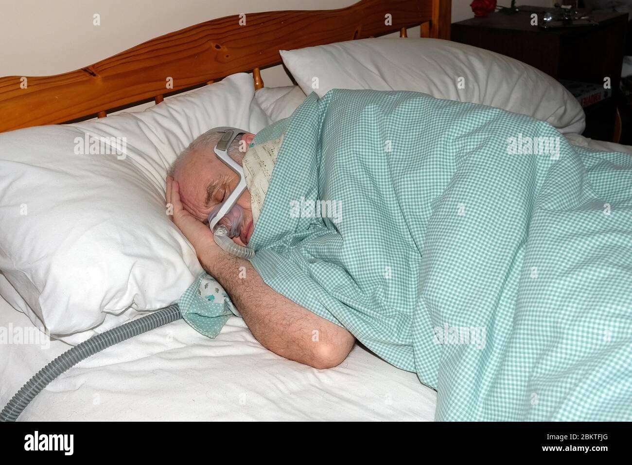 May 2020 - Mature man fast asleep wearing the mask of a CPAP sleep ...
