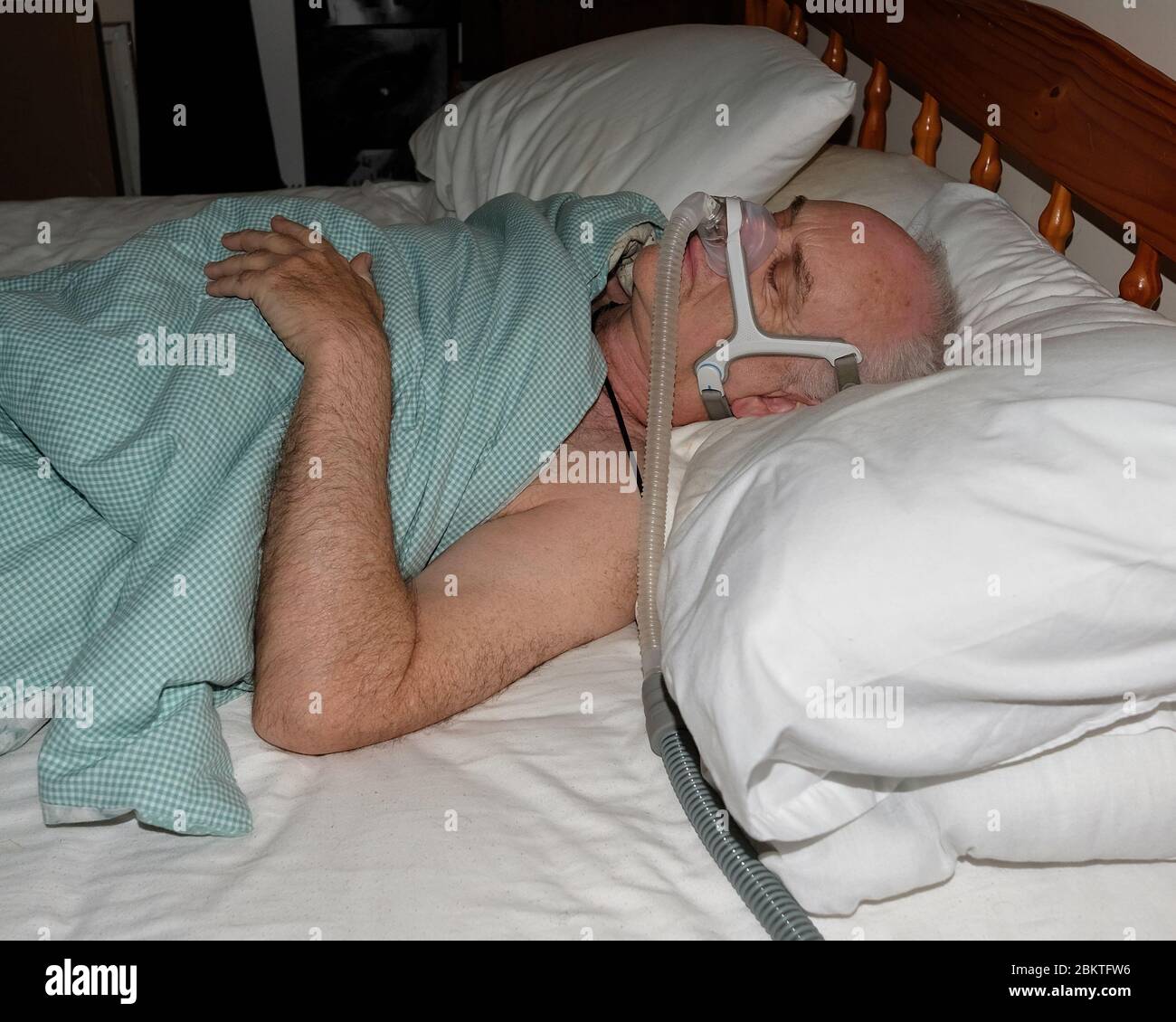 May 2020 - Mature man fast asleep wearing the mask of a CPAP sleep ...