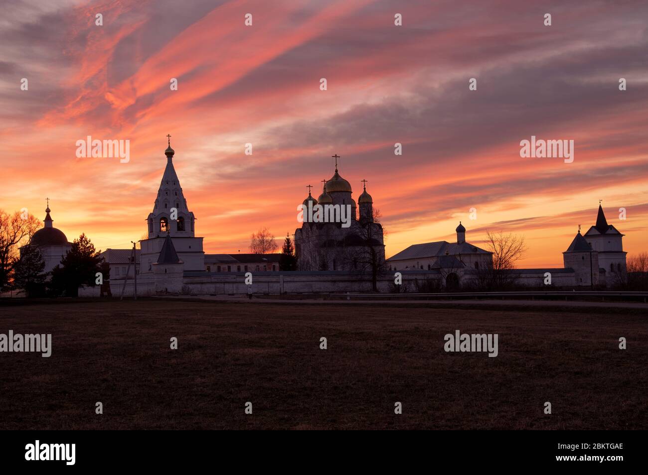 The black silhouette of the monastery against the bright sunset sky ...