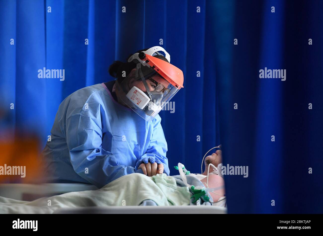 Clinical staff wear Personal Protective Equipment (PPE) as they care ...