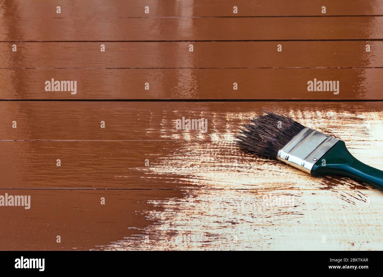 Painting a wooden table using paintbrush. Brush for painting. Painted ...