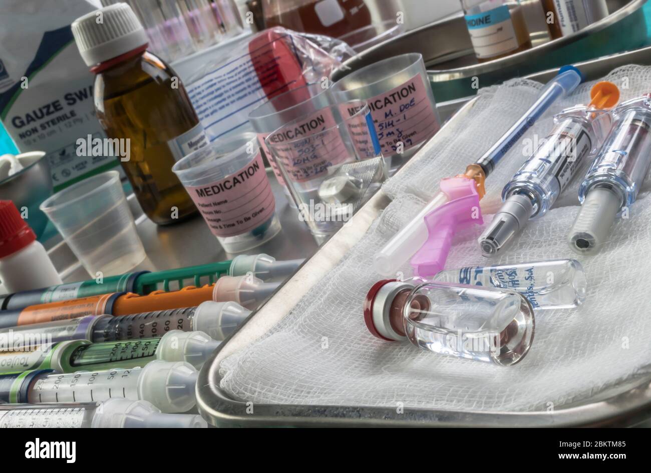 Diverse medication in glasses monodose along with insulin injectors in ...