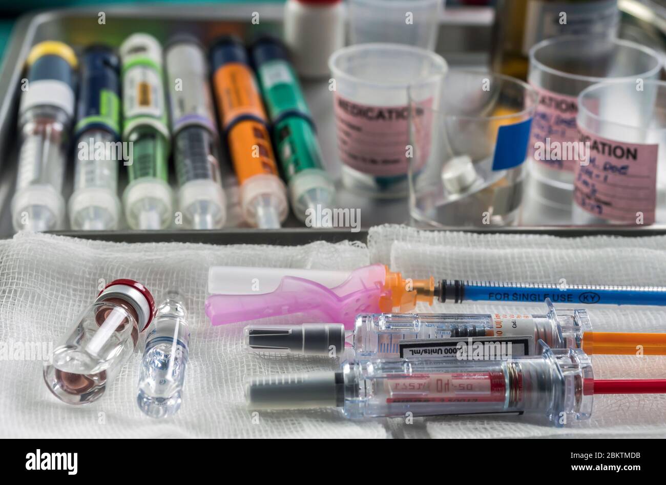 Diverse medication in glasses monodose along with insulin injectors in ...