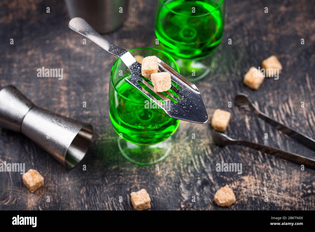 Glass of absinthe with cane sugar Stock Photo - Alamy