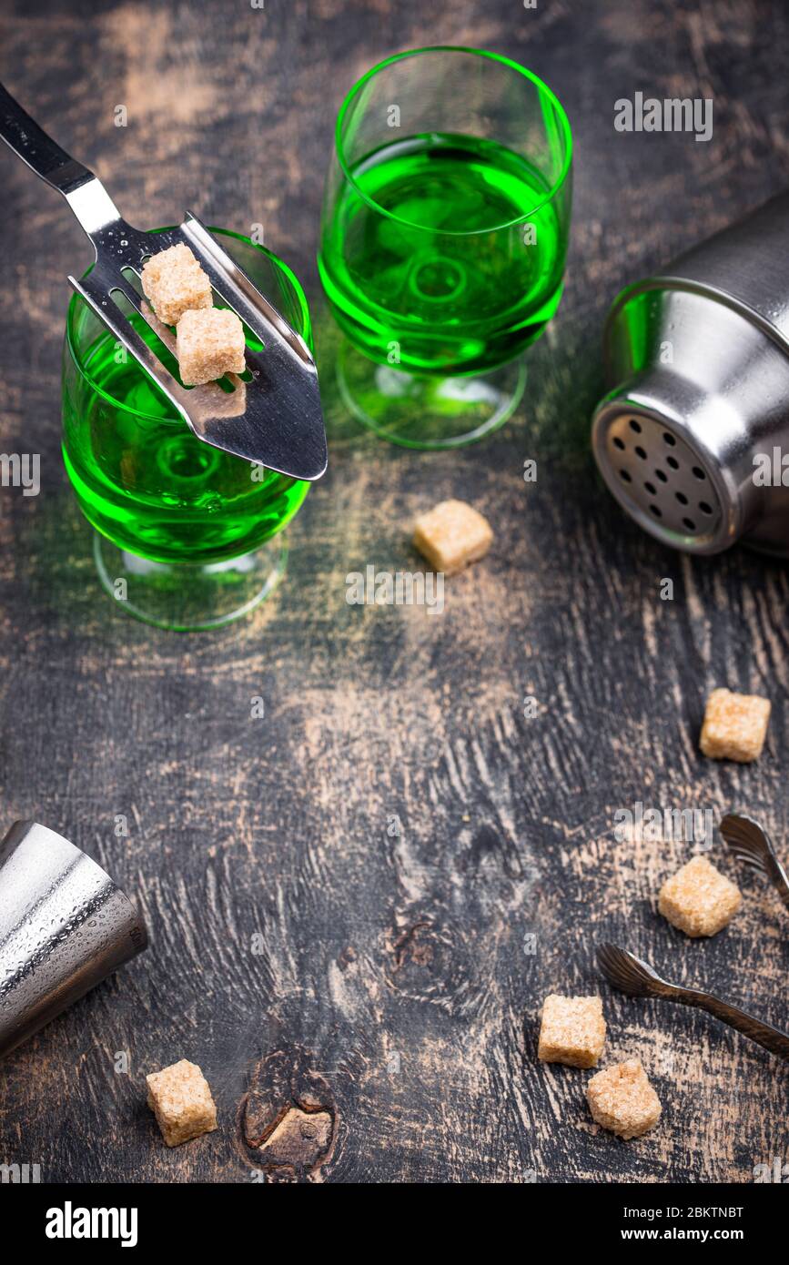 Glass of absinthe with cane sugar Stock Photo - Alamy