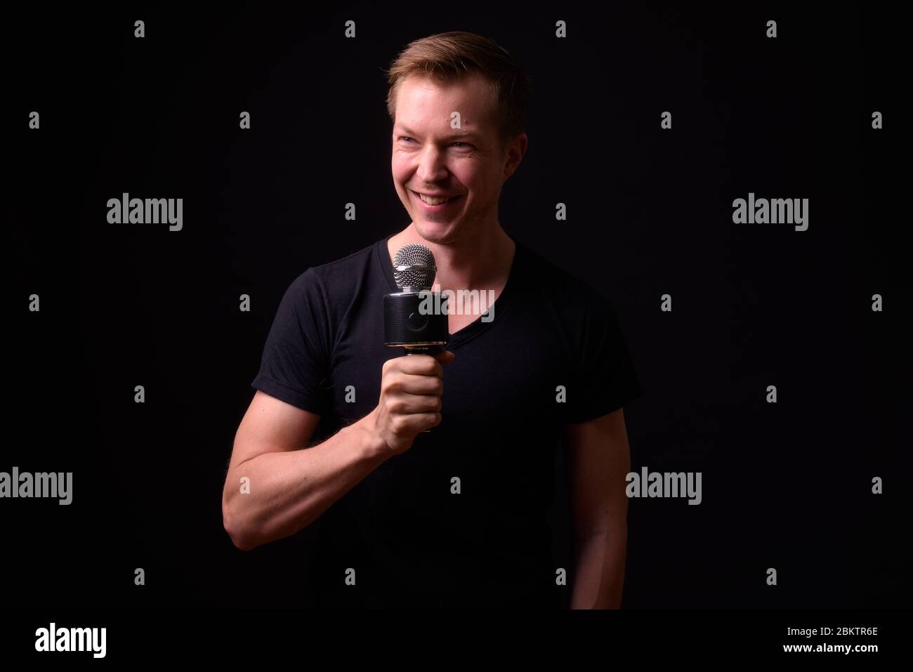 Black man singing microphone black hi-res stock photography and images ...