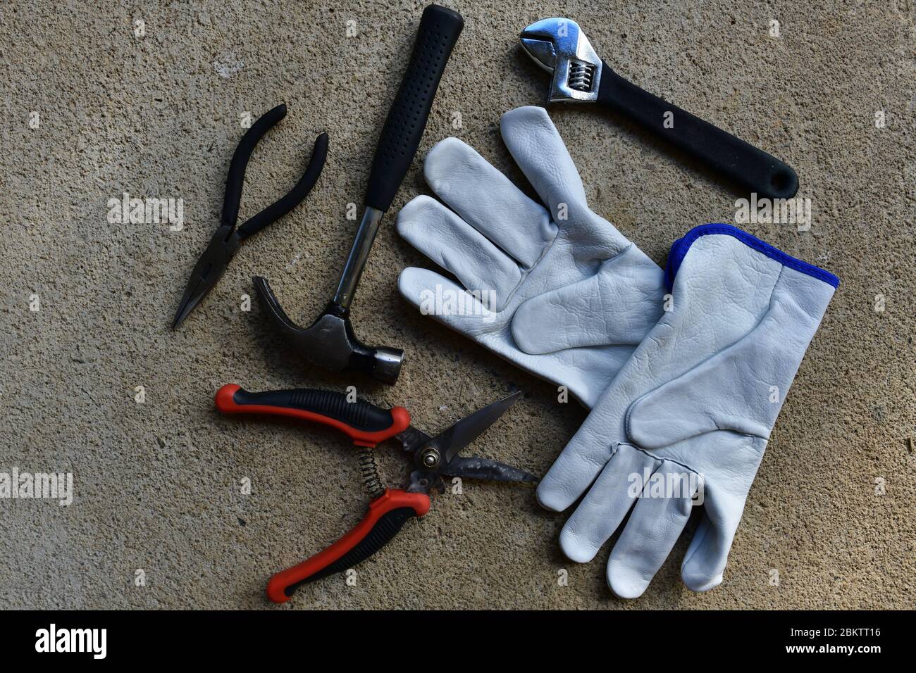 Tools laid out on a concrete slab ready to begin work Stock Photo - Alamy